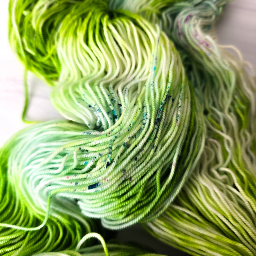 Plant Seeds in the Cracks - Hand dyed yarn, bright green soft teal whi ...