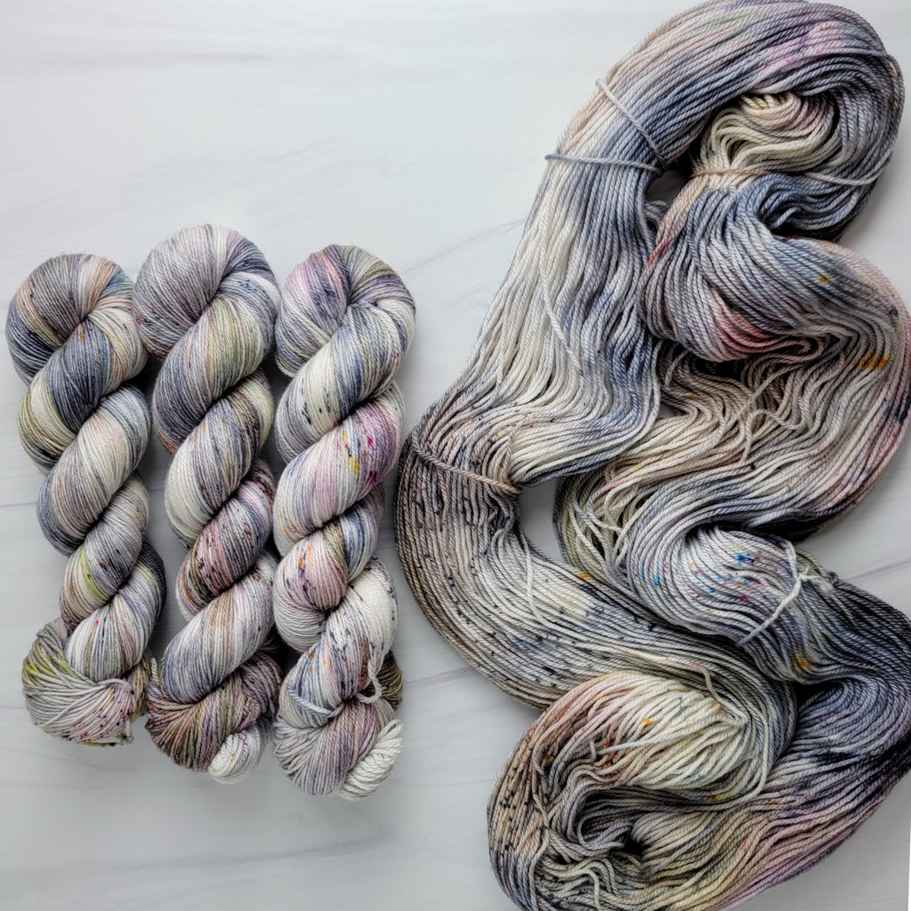 Pebbles in the Sand- Hand dyed variegated yarn - grey with speckles of ...